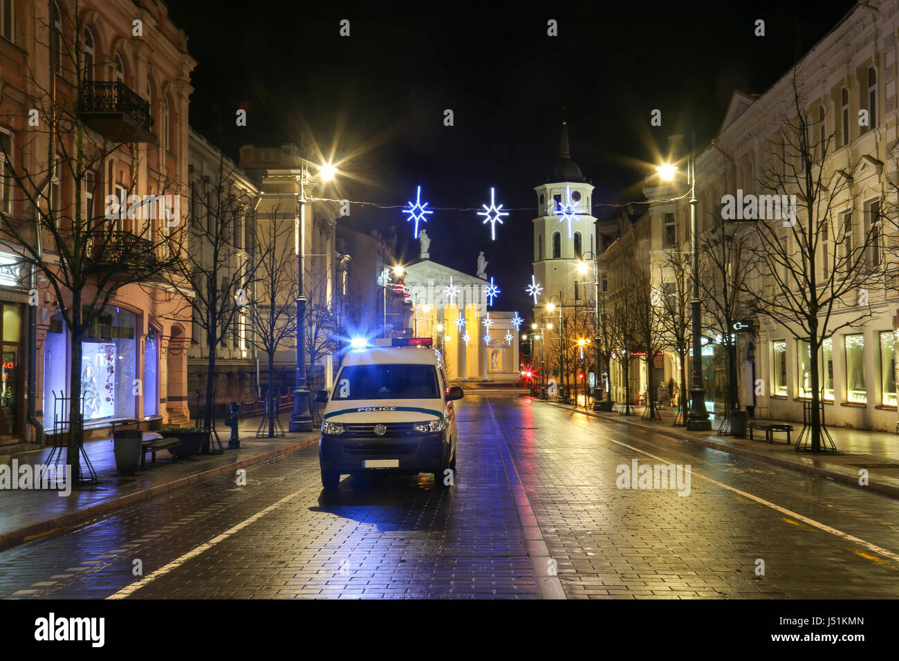 A police car while night patrolling of city streets Stock Photo - Alamy