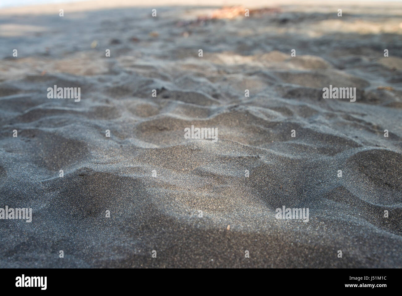 dark volcanic sand on the beach Stock Photo - Alamy