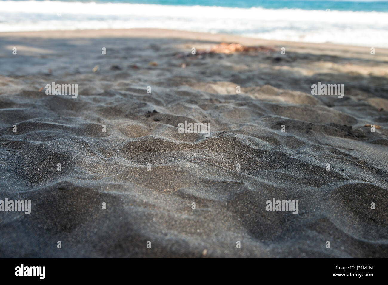 dark volcanic sand on the beach Stock Photo - Alamy