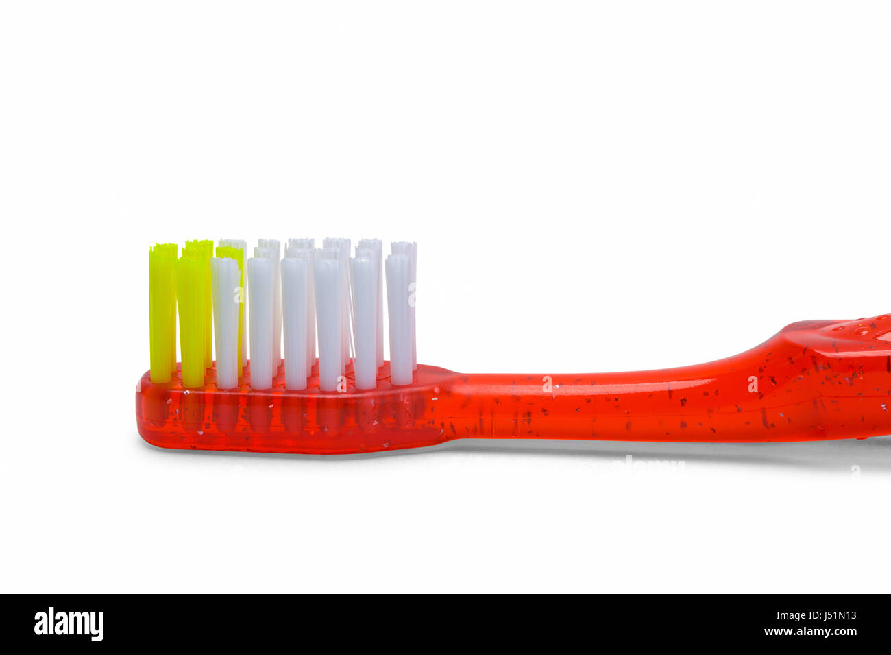 New Red Toothbrush Close Up Isolated on White Background Stock Photo ...