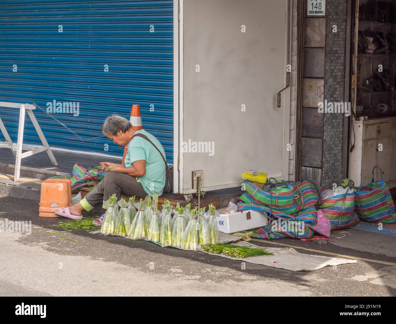 Luodong, Taiwan - October 18, 2016: Mature, Taiwanese woman with grey ...