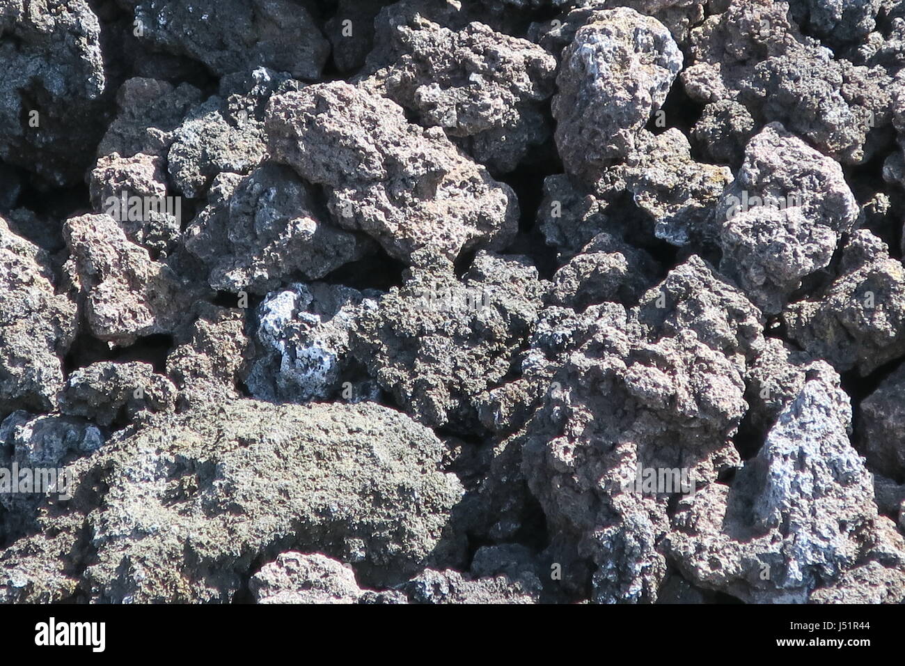 Lots of lava stones on volcanic mount Etna on Sicily island in Italy ...