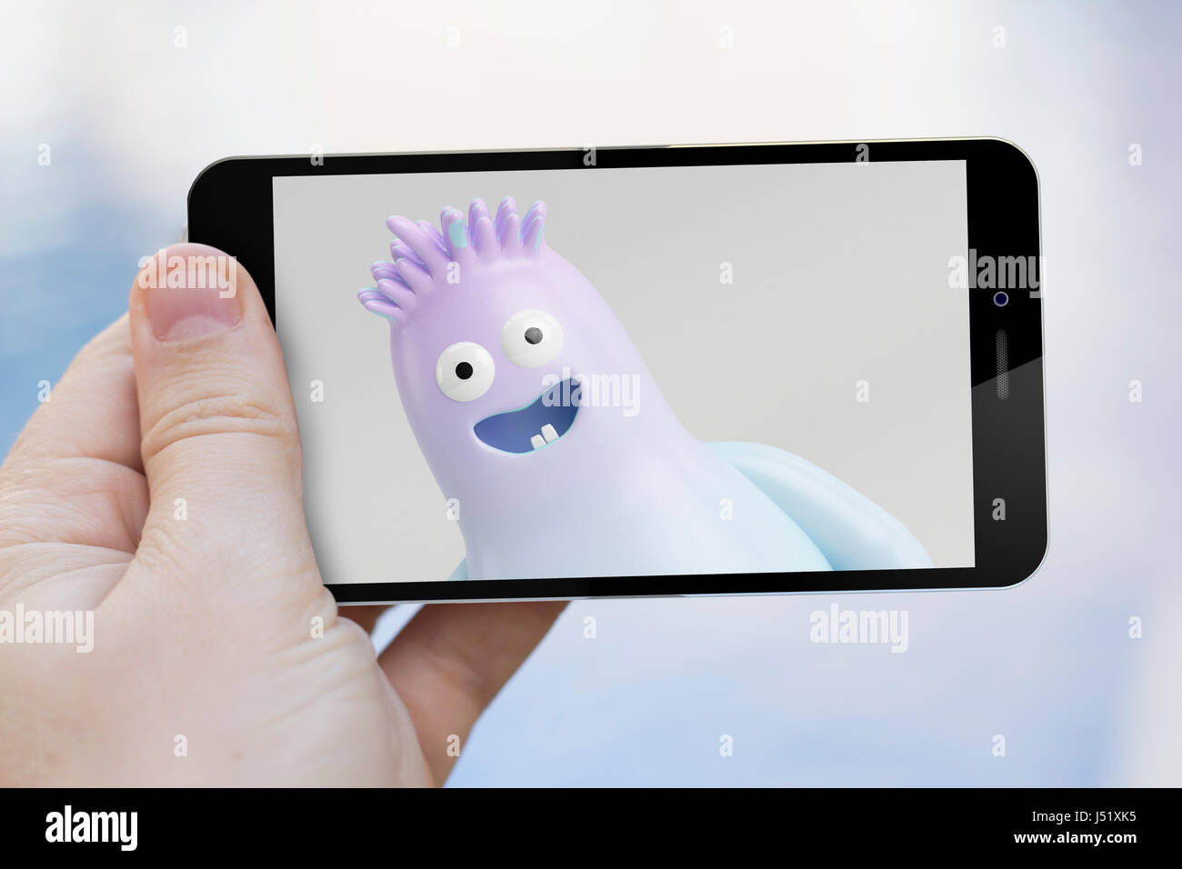 trolling concept: hand holding a smartphone showing troll on screen ...