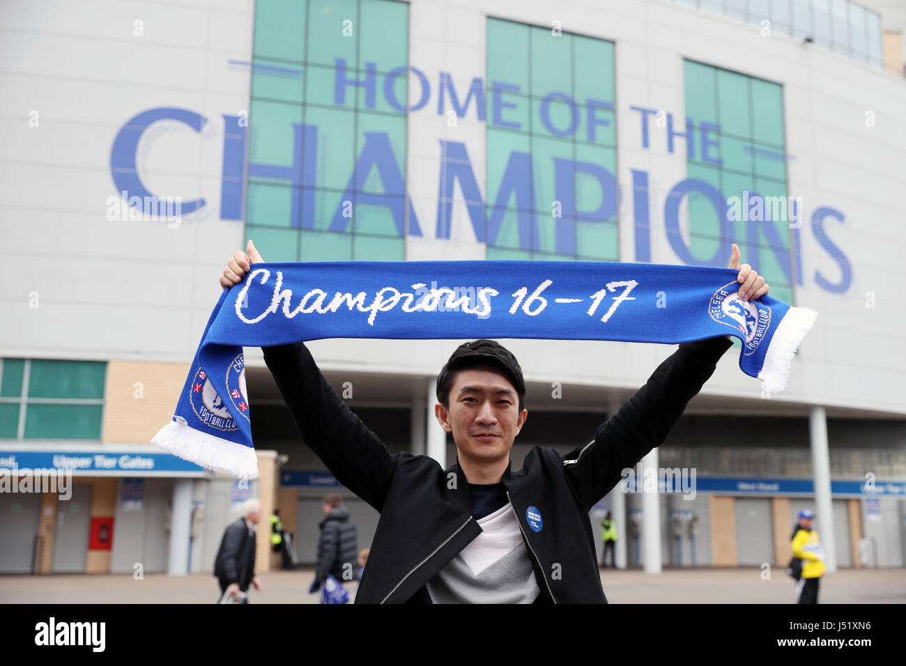 A Chelsea fan poses for a picture before the Premier League match at ...