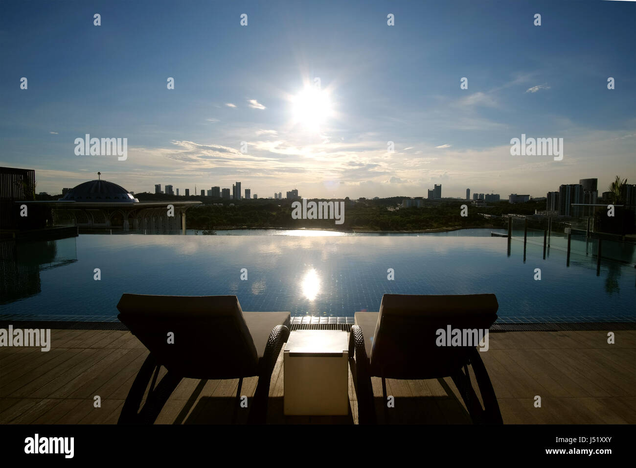Swimming pool and sunset Stock Photo - Alamy