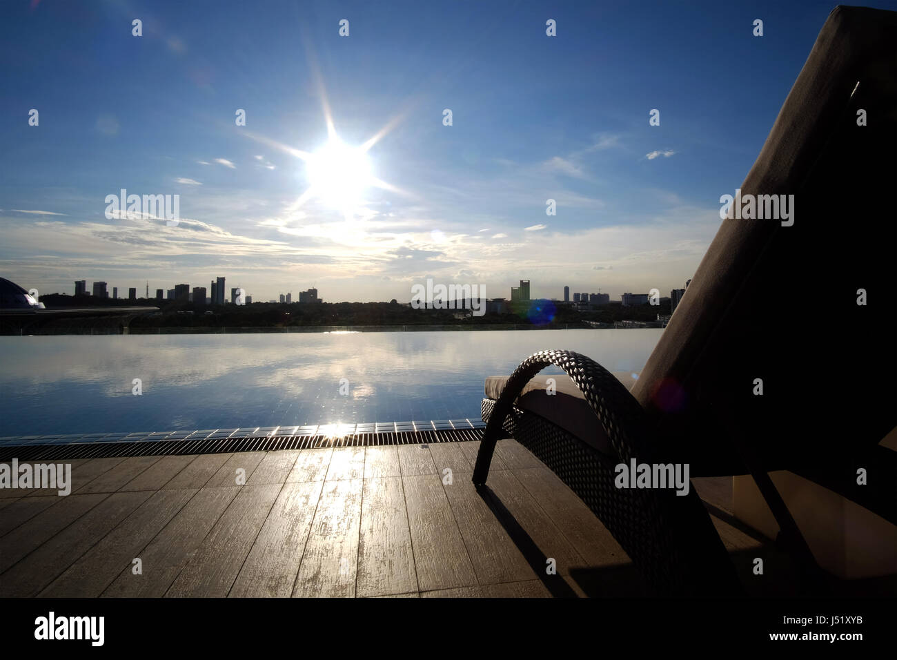 Swimming pool and sunset Stock Photo - Alamy