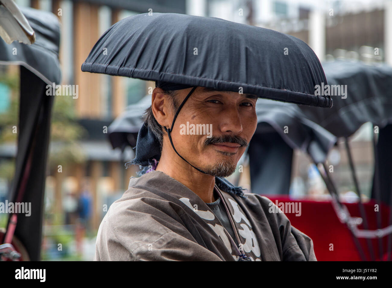TOKYO, JAPAN - OCTOBER 3, 2016: Unidentified rickshaw runner at Asakusa ...