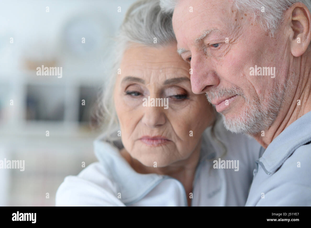 Beautiful sad elderly couple Stock Photo - Alamy