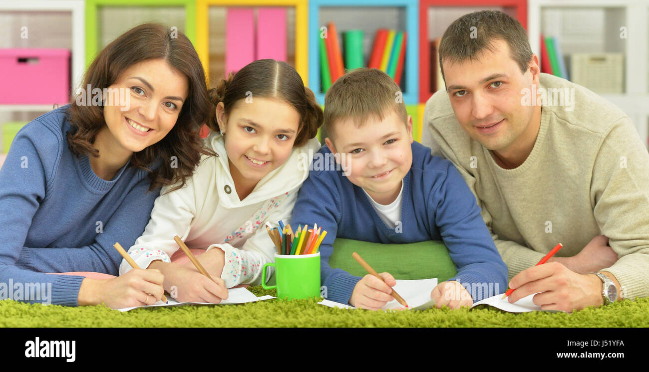 Children draw with their parents Stock Photo - Alamy