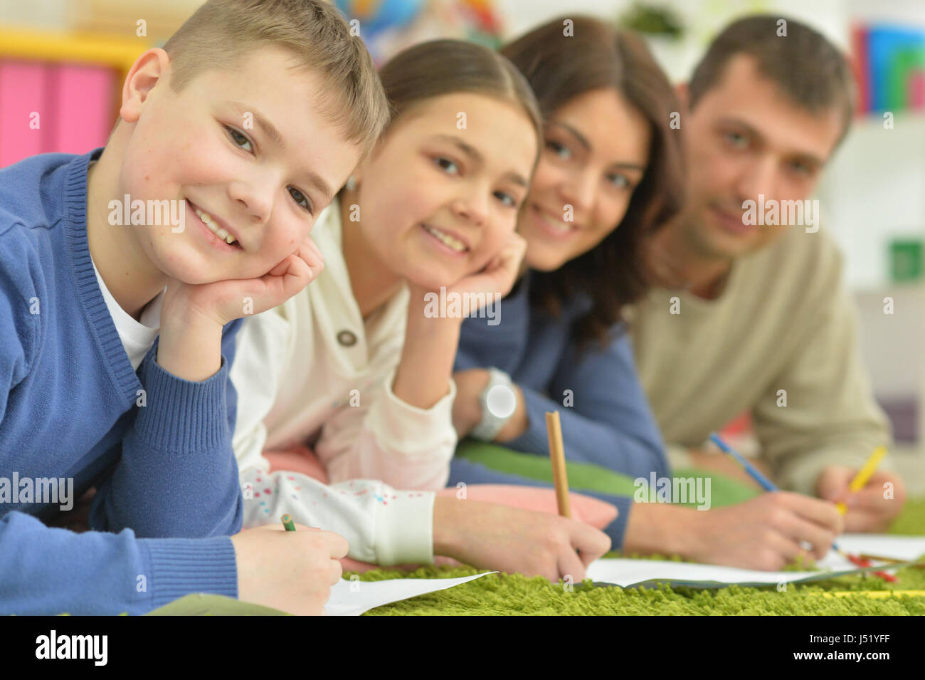 Children draw with their parents Stock Photo - Alamy
