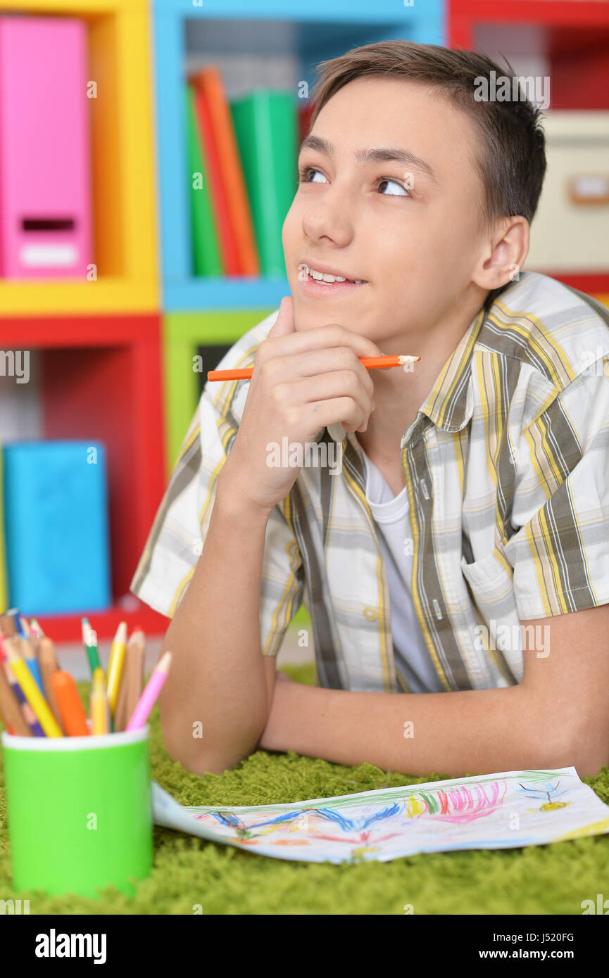 Boy drawing with pencils Stock Photo - Alamy