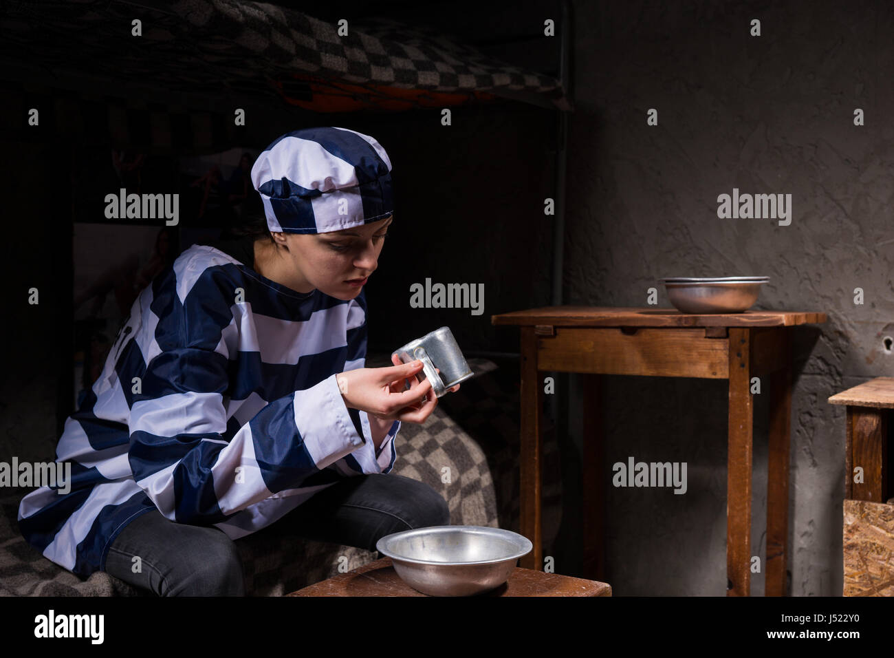 Female prison inmate in cell hi-res stock photography and images - Alamy