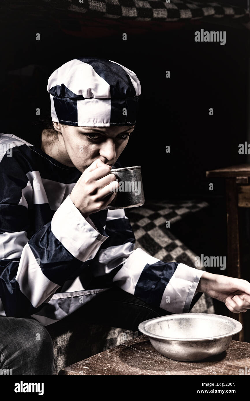 Female prison inmate in cell hi-res stock photography and images - Alamy