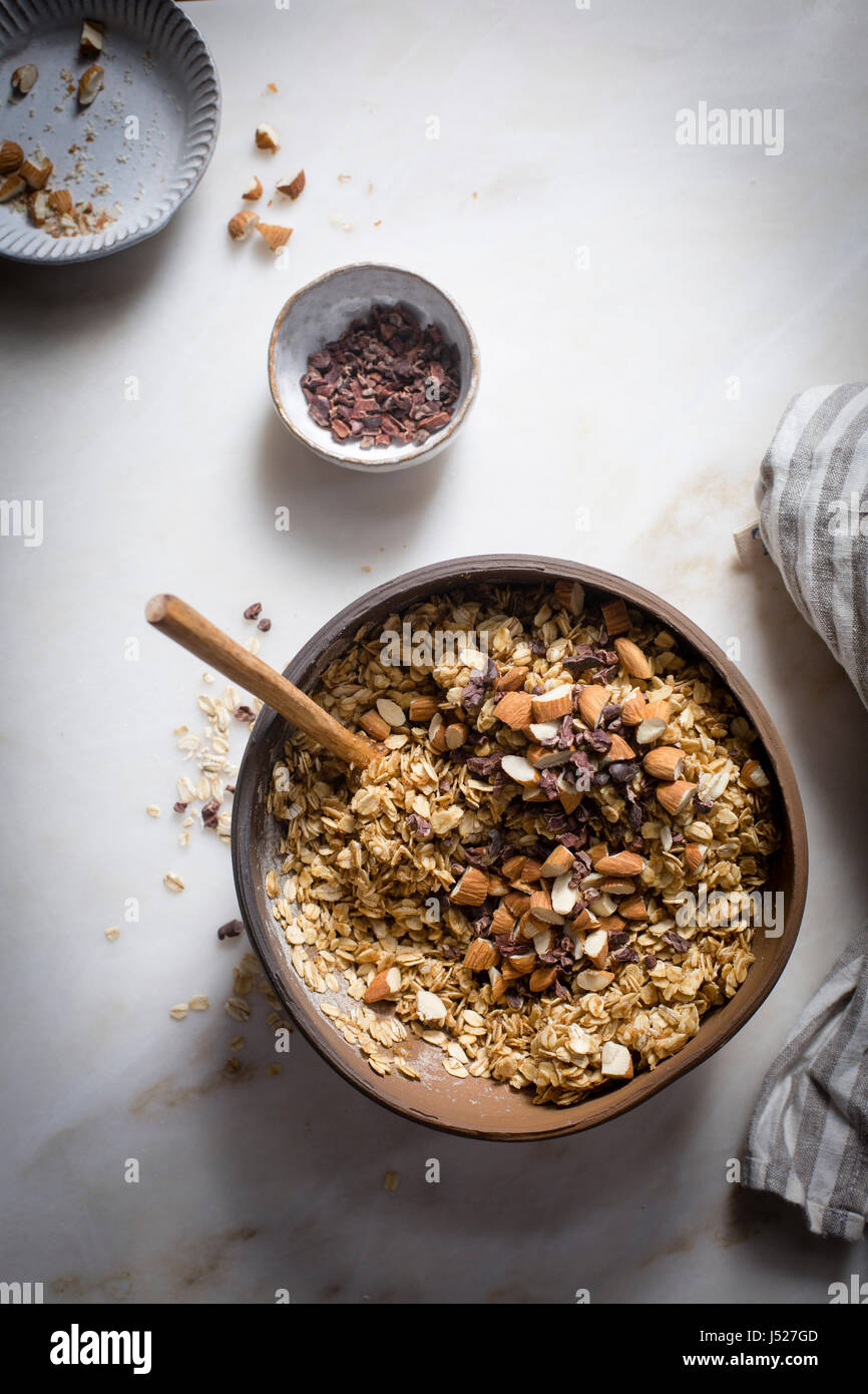 Preparation of granola mixture in a mable backdrop on top view Stock ...