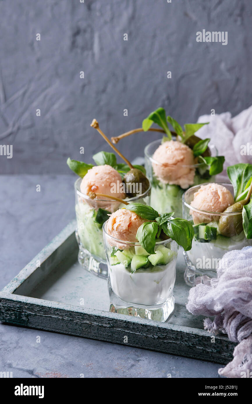 Verrines appetizer with salmon pate, red caviar, cucumber, cream cheese ...