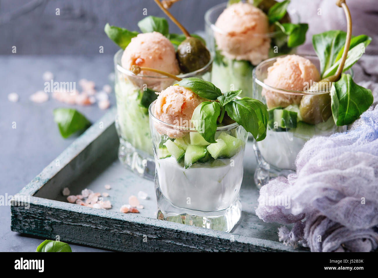 Verrines appetizer with salmon pate, red caviar, cucumber, cream cheese ...