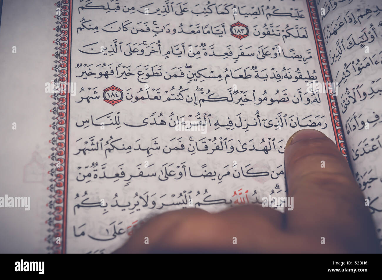 hand pointing at aya of ramadan in quran, ramadan concept Stock Photo ...