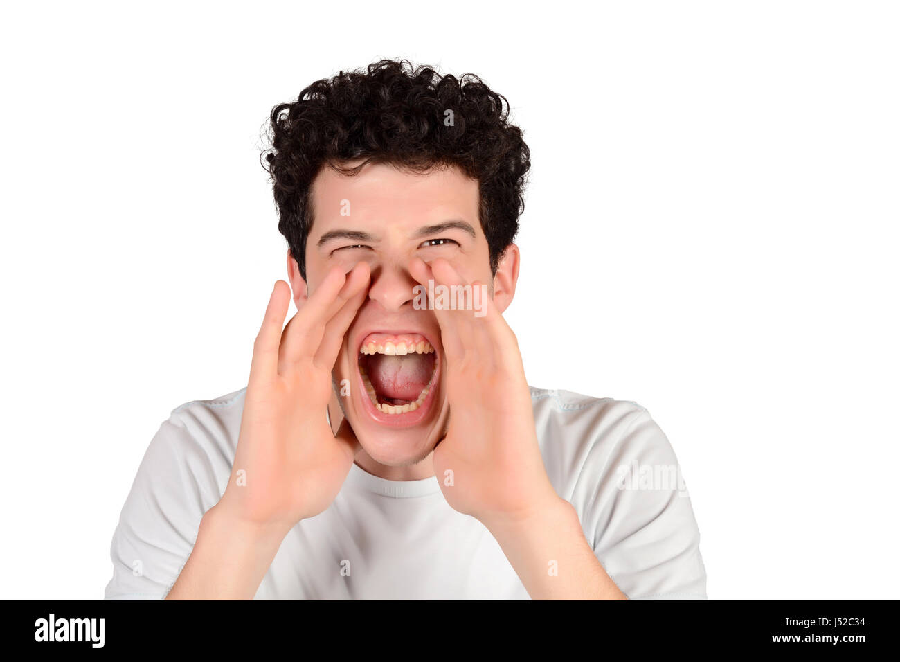 Portrait of a young man shouting. Isolated white background Stock Photo ...