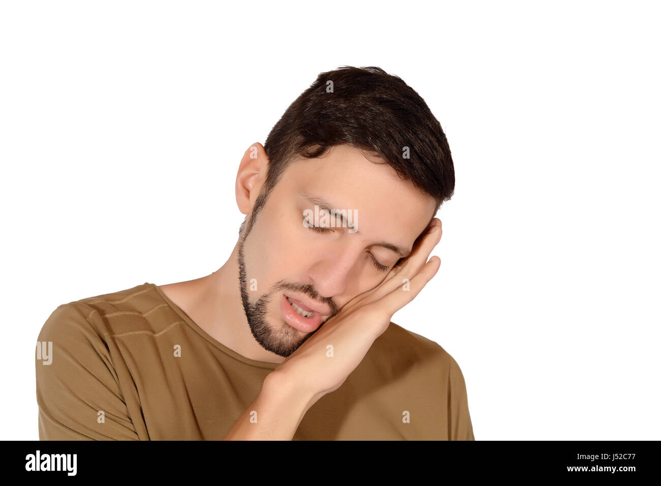 Portrait of a young man sleepy. Isolated white background Stock Photo ...