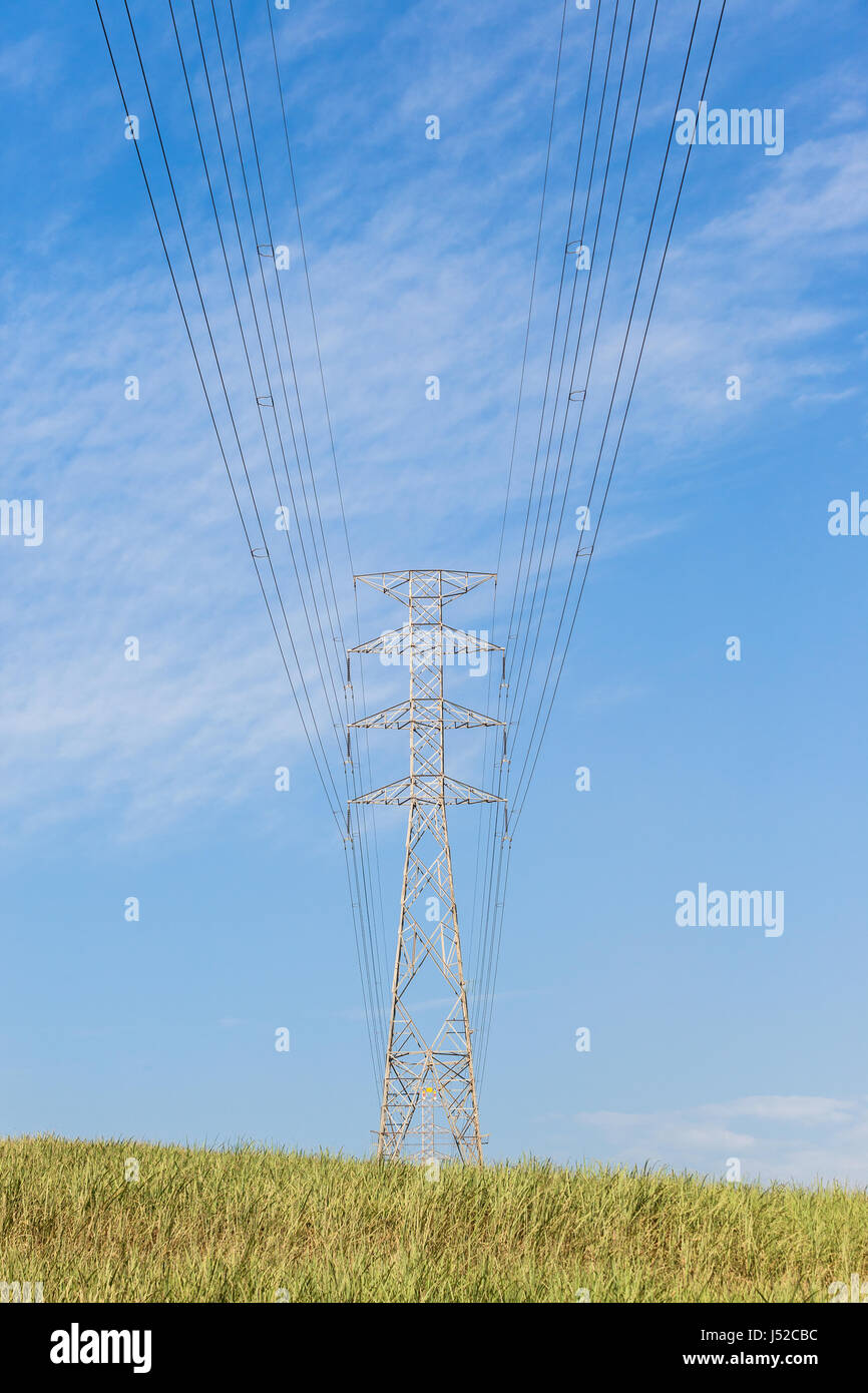 Electricity power lines tower with cables crossing countryside Stock ...