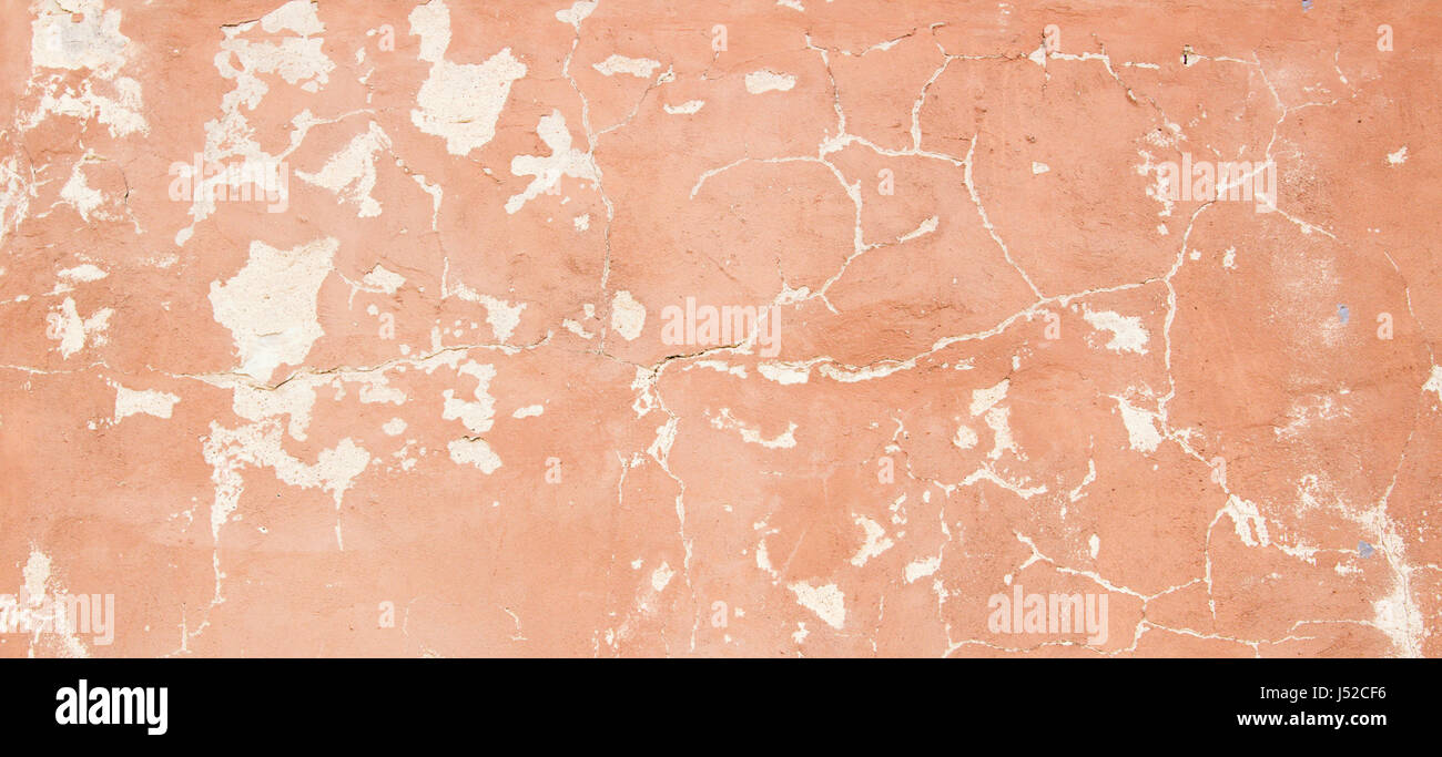 Old empty painted plaster wall with cracked structure, texture ...