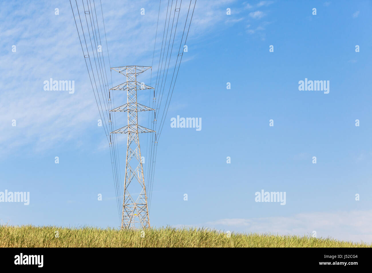 Electricity power lines tower with cables crossing countryside Stock ...