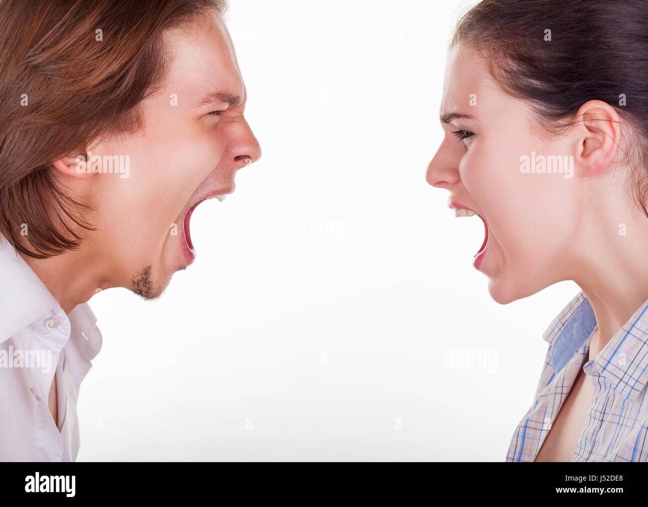 Close-up portrait of a pair of angry shouting against each other on a ...