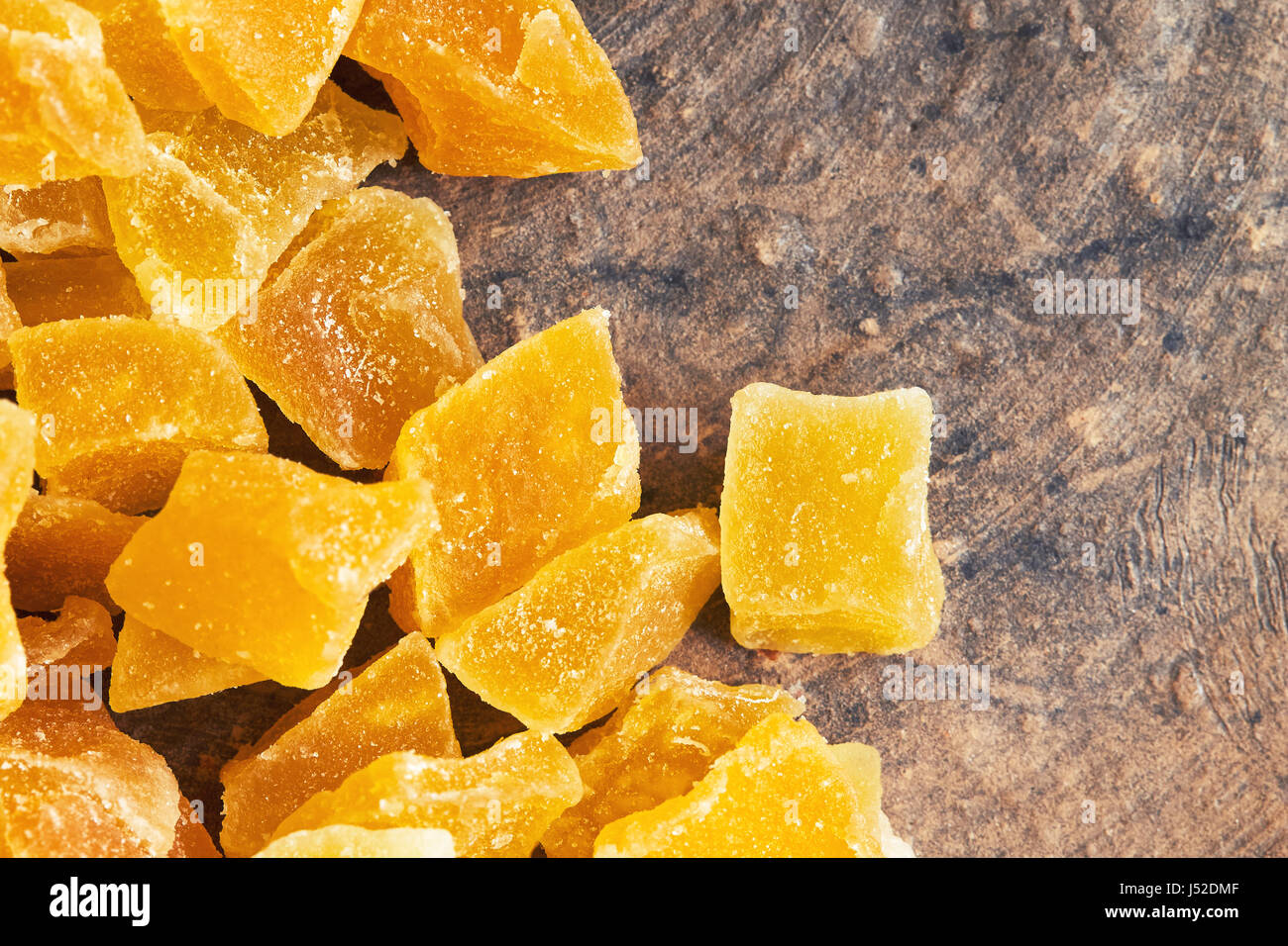 Dried and candied mango on rustic background. Top view with copy space ...
