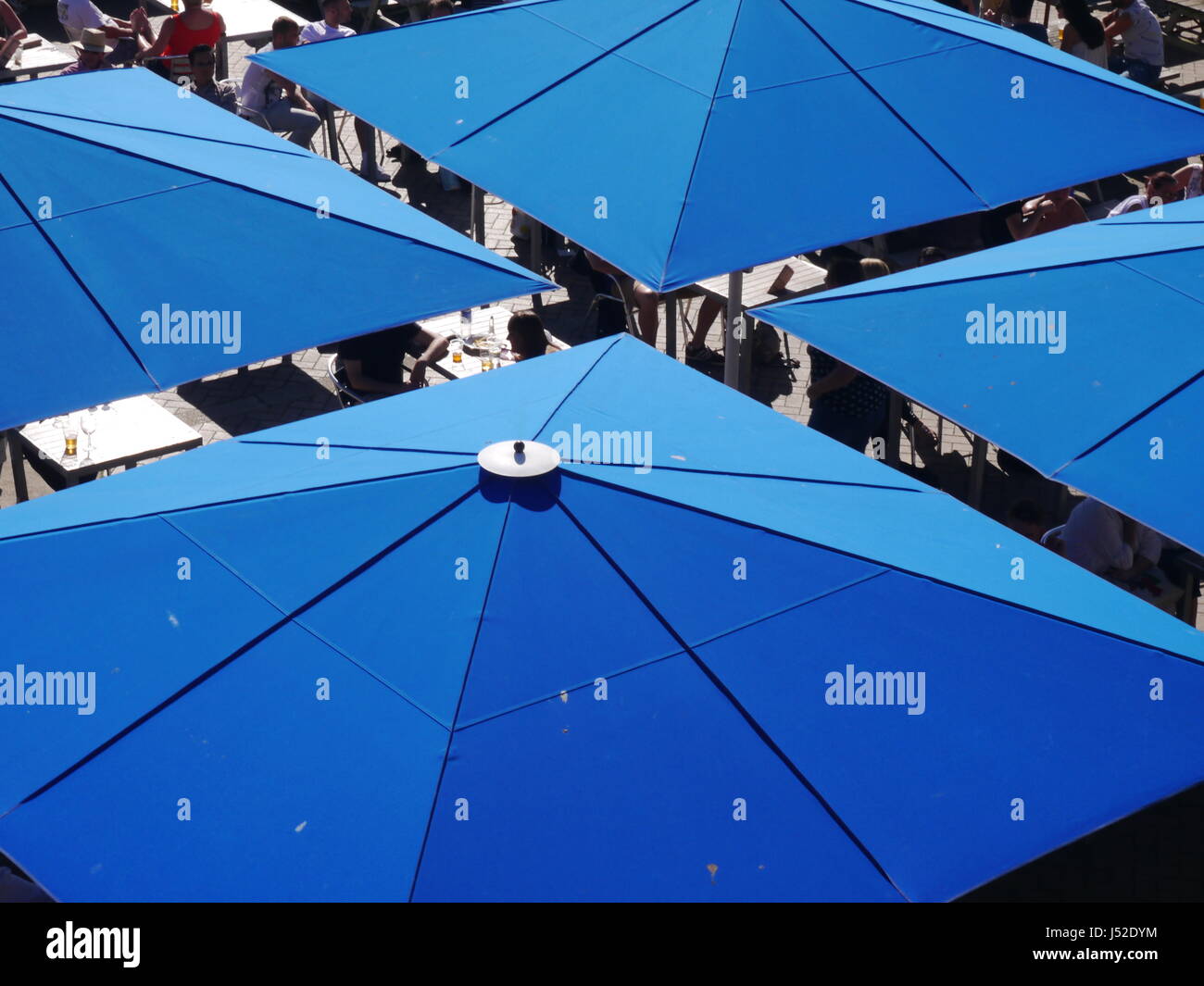 Large blue umbrellas on Brighton seafront, seen from above Stock Photo ...