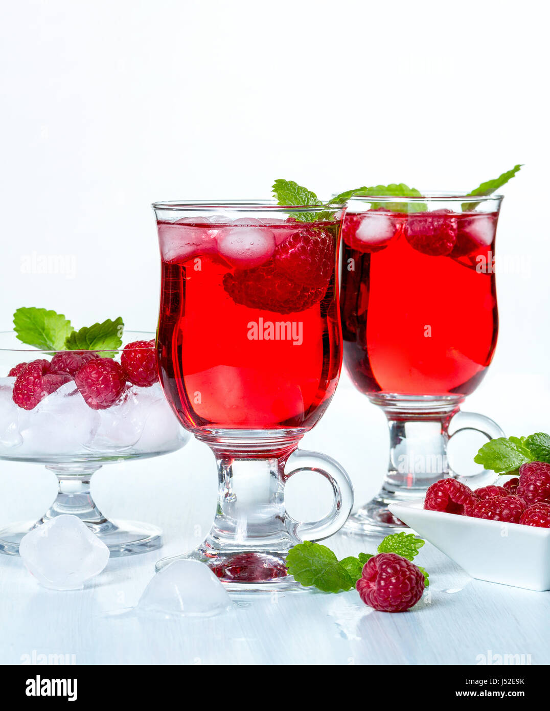 Alcohol cocktail with raspberries and mint Stock Photo - Alamy