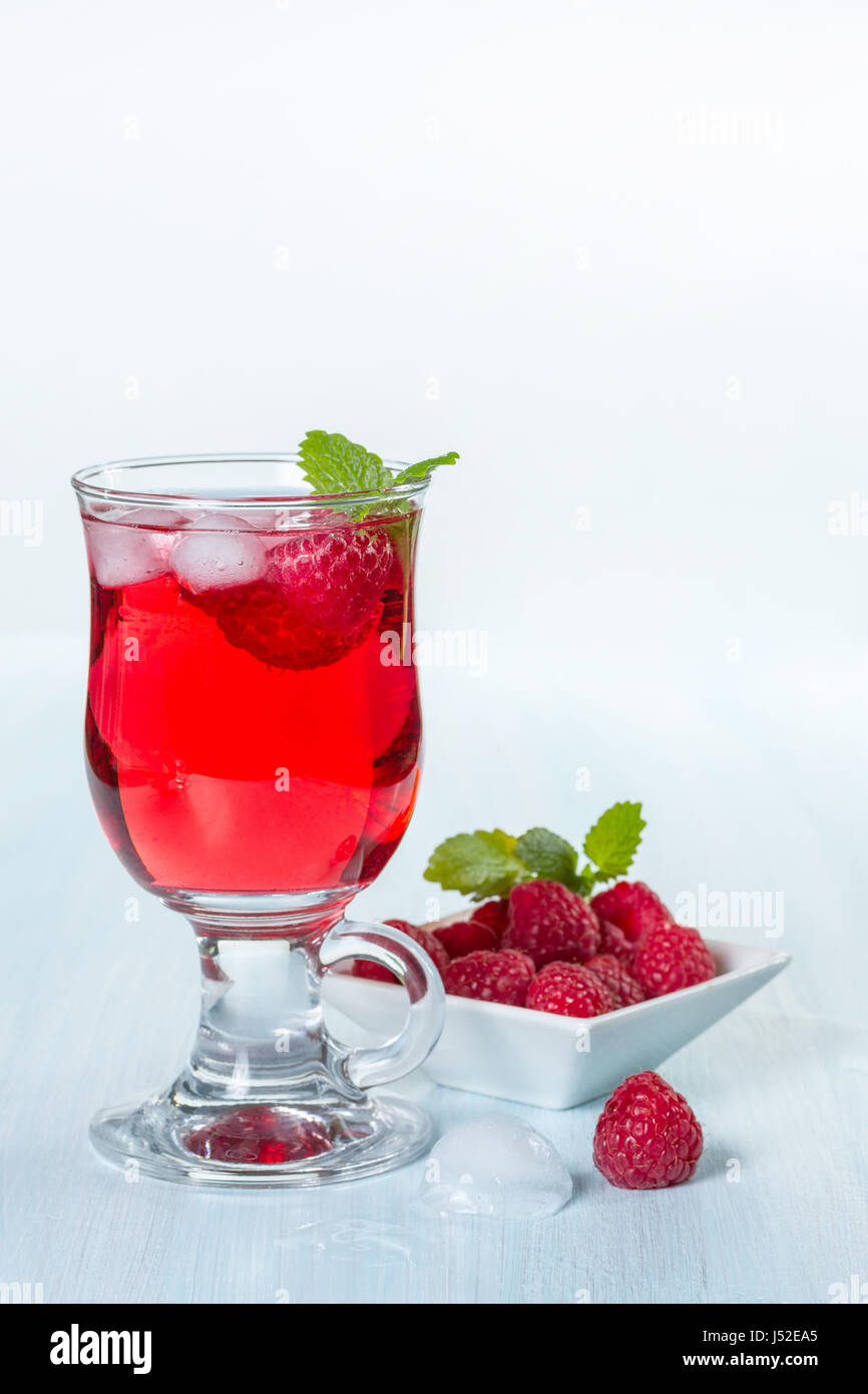 Alcohol cocktail with raspberries and mint Stock Photo - Alamy