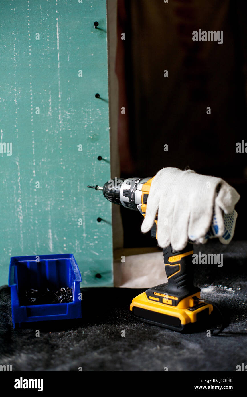 interior house alterations works Drywall Construction worker holding ...