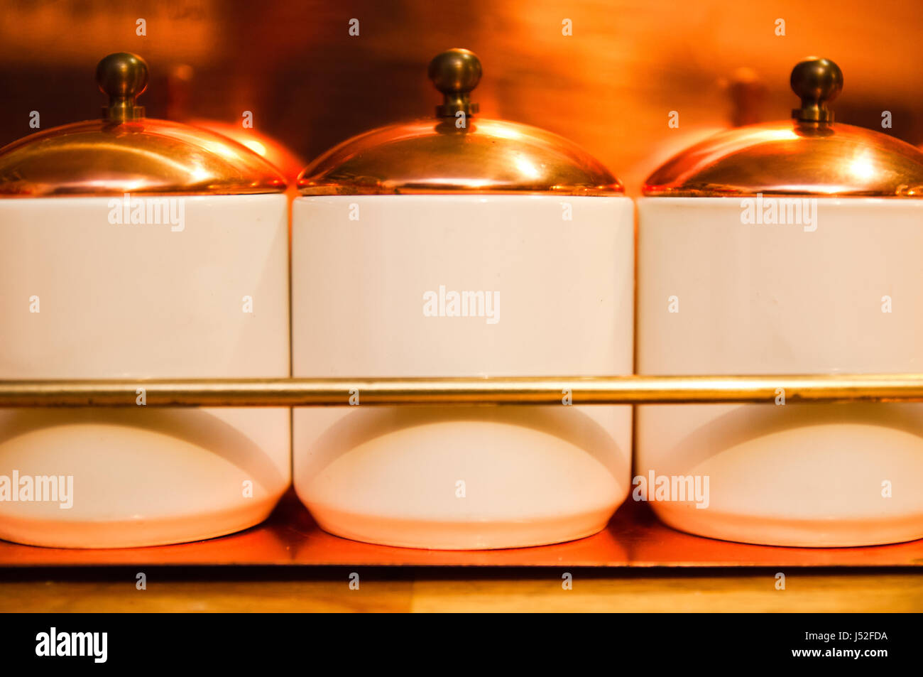 Copper and ceramic spice rack Stock Photo - Alamy