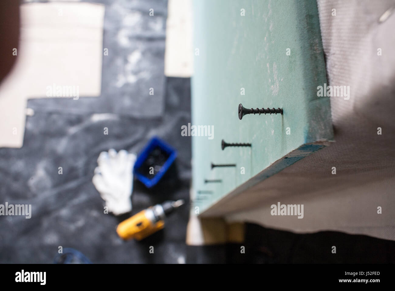 interior house alterations works Drywall Construction worker holding ...