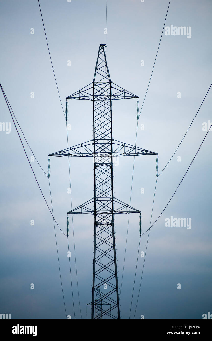 power lines Pylon and transmission power line in sunset Stock Photo - Alamy