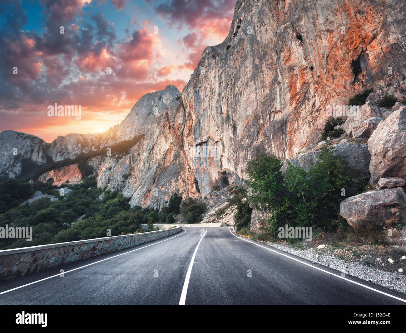 Beautiful asphalt road. Colorful landscape with high rocks, mountain ...