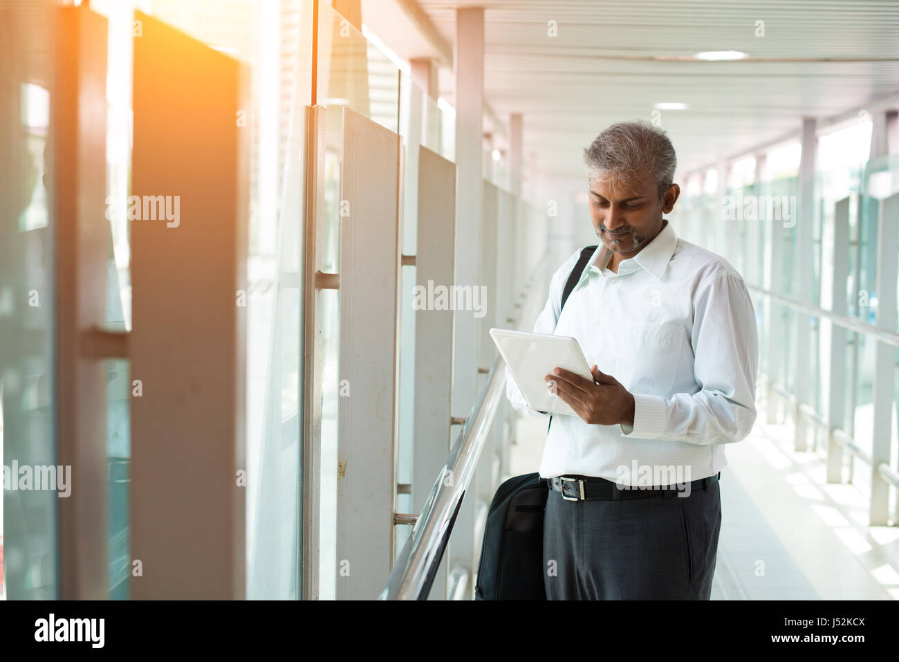 indian businessman outdoor with a computer tablet Stock Photo - Alamy