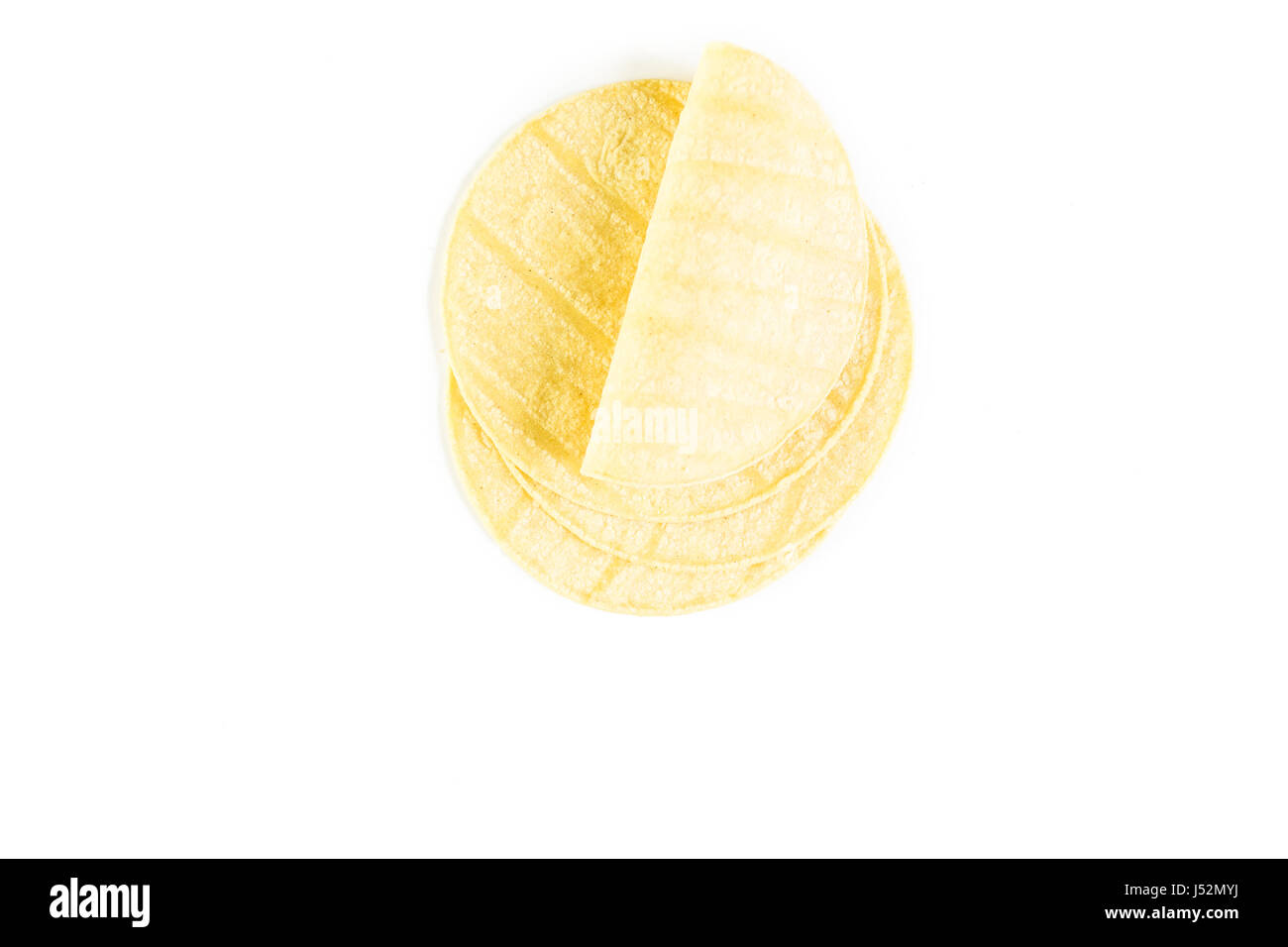 Fresh yellow corn tortillas on a white background Stock Photo - Alamy
