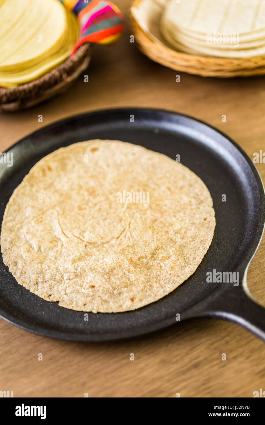 Variety of fresh tortillas on a wood background Stock Photo - Alamy