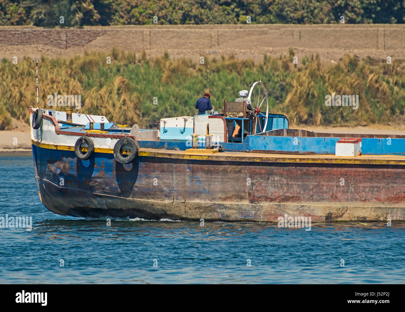 Old traditional barge boat traveling on river Nile through rural ...