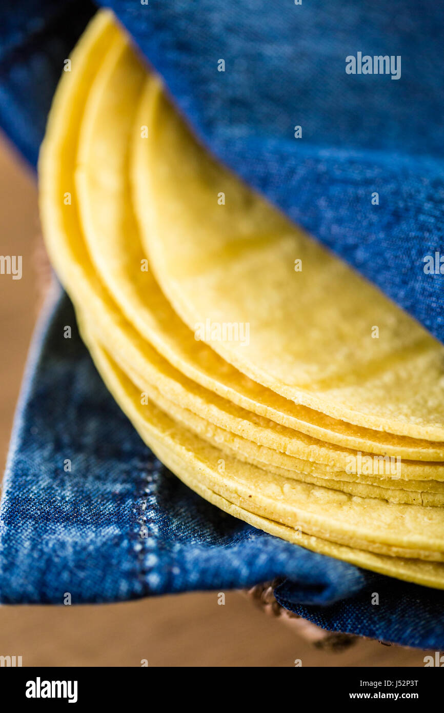 Fresh yellow corn tortillas on a wood background Stock Photo - Alamy