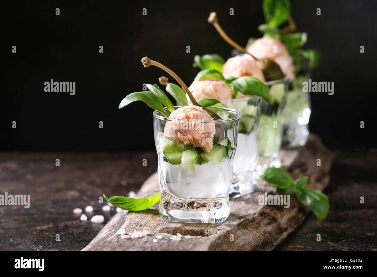 Verrines appetizer with salmon pate, red caviar, cucumber, cream cheese ...