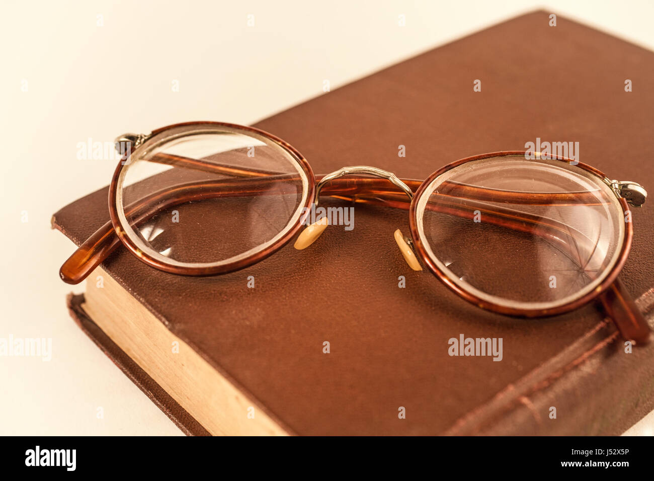 Old grandmother's glasses and a dilapidated book closeup Stock Photo ...