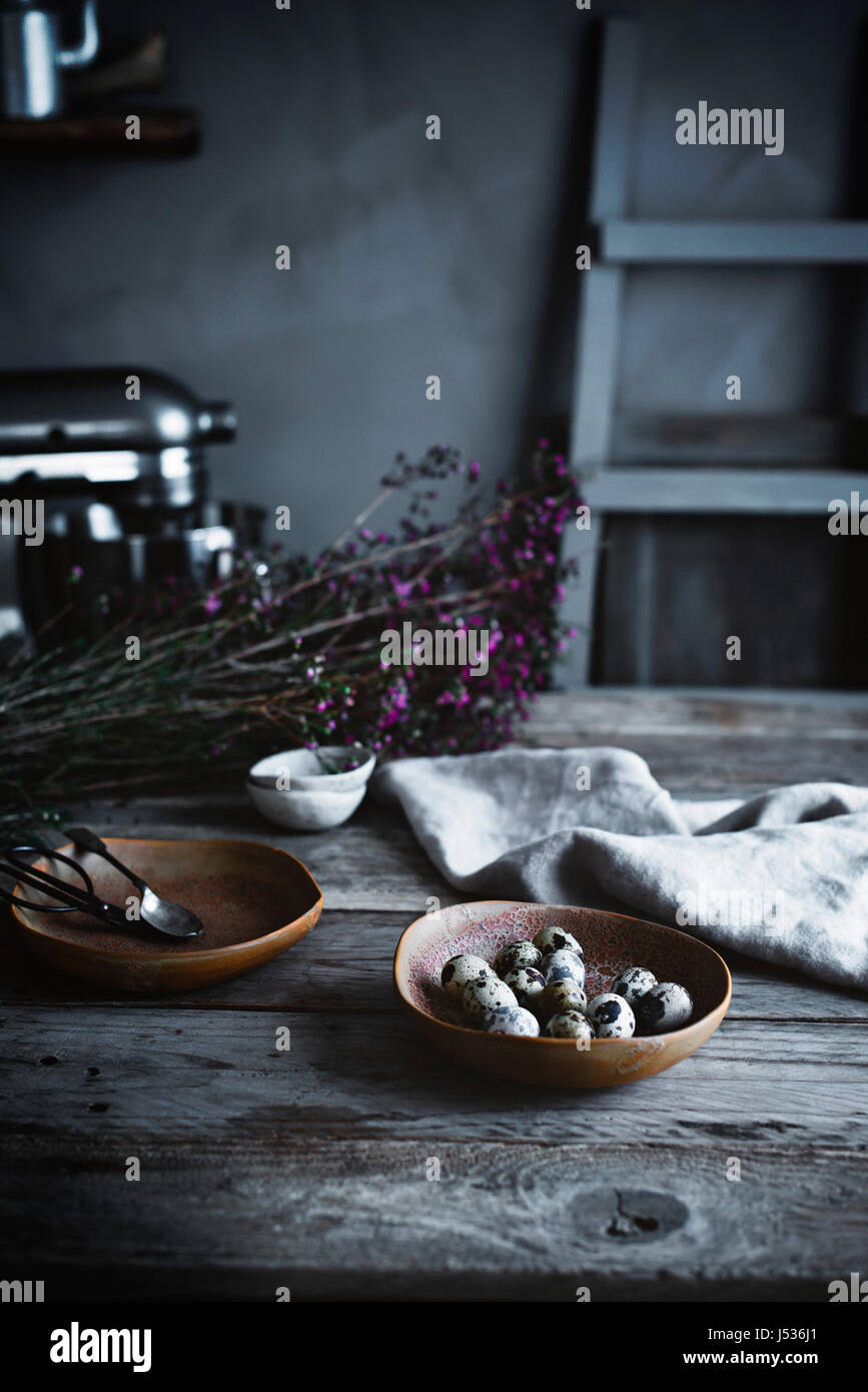 Qualis eggs on a country kitchen table Stock Photo - Alamy