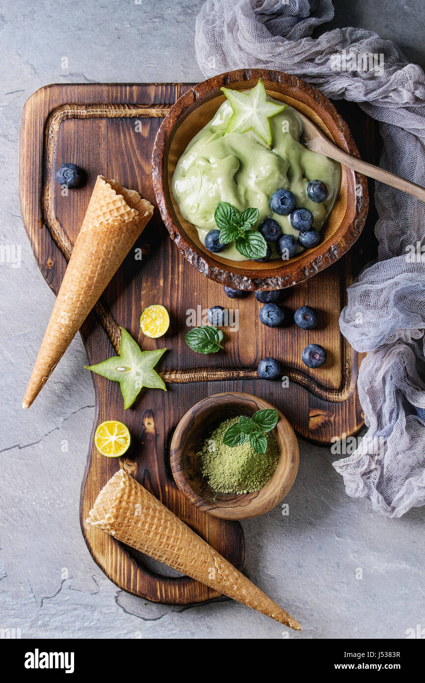 Bowl of Green tea matcha soft elastic ice cream with mint leaves ...