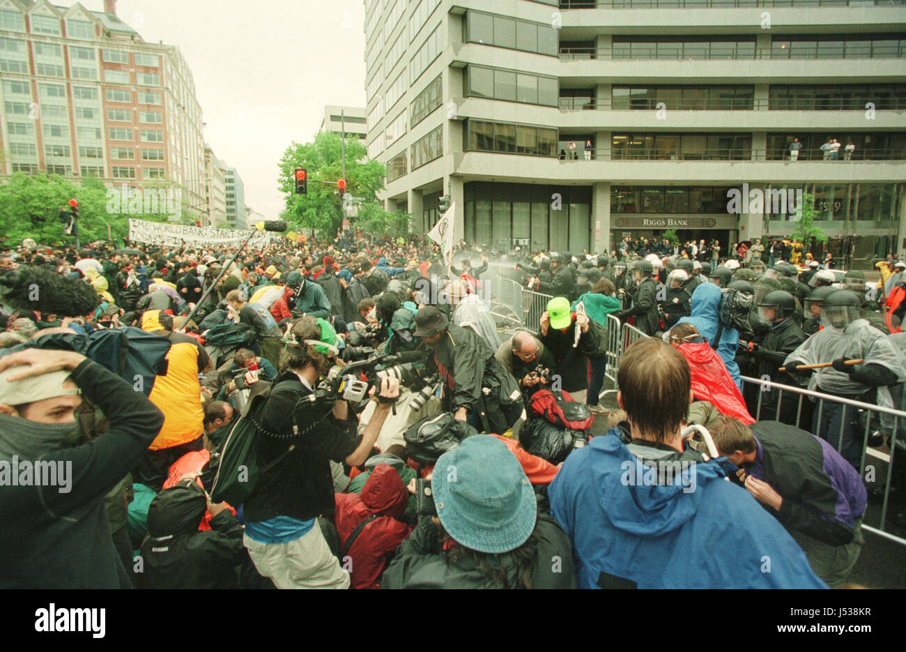 Police spraying crowd with pepper spray. Protesters block streets and ...
