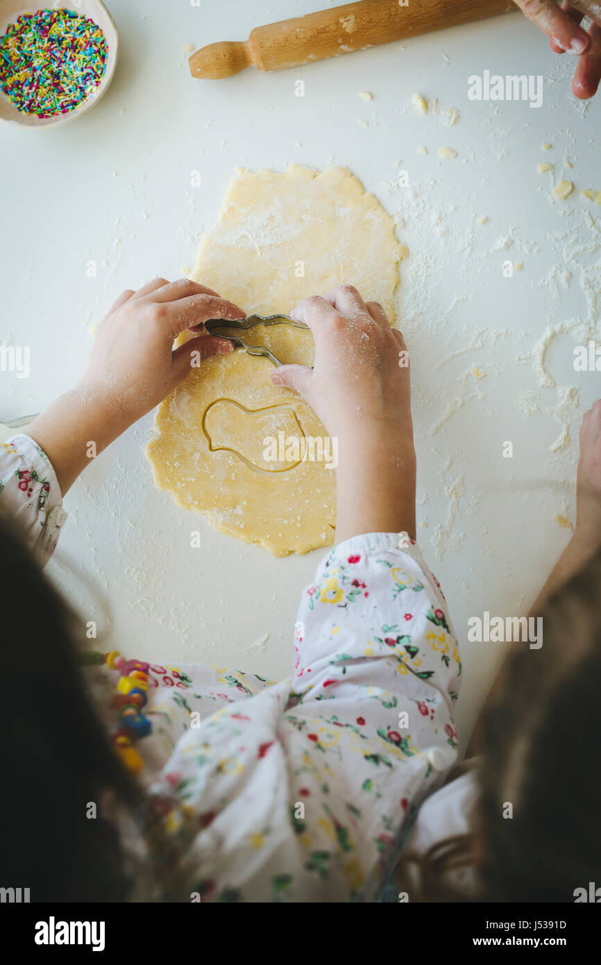 Girl making chicken shaped cookies Stock Photo - Alamy