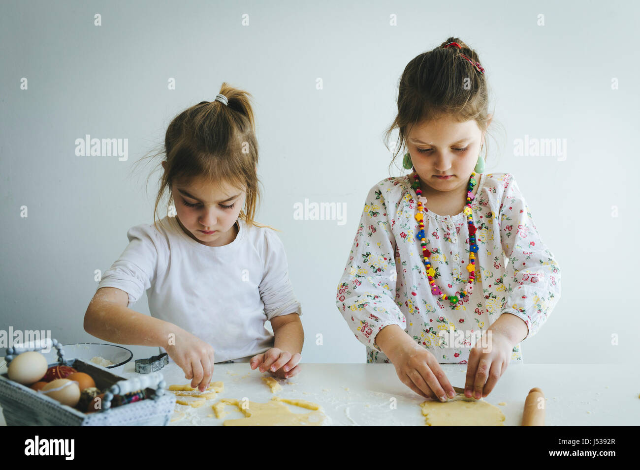 Sisters making shortbread cookies Stock Photo - Alamy