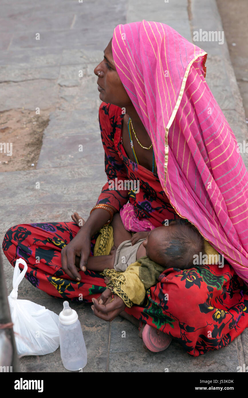 Indian woman with baby is begging on the street of Jaipur, India,Asia ...