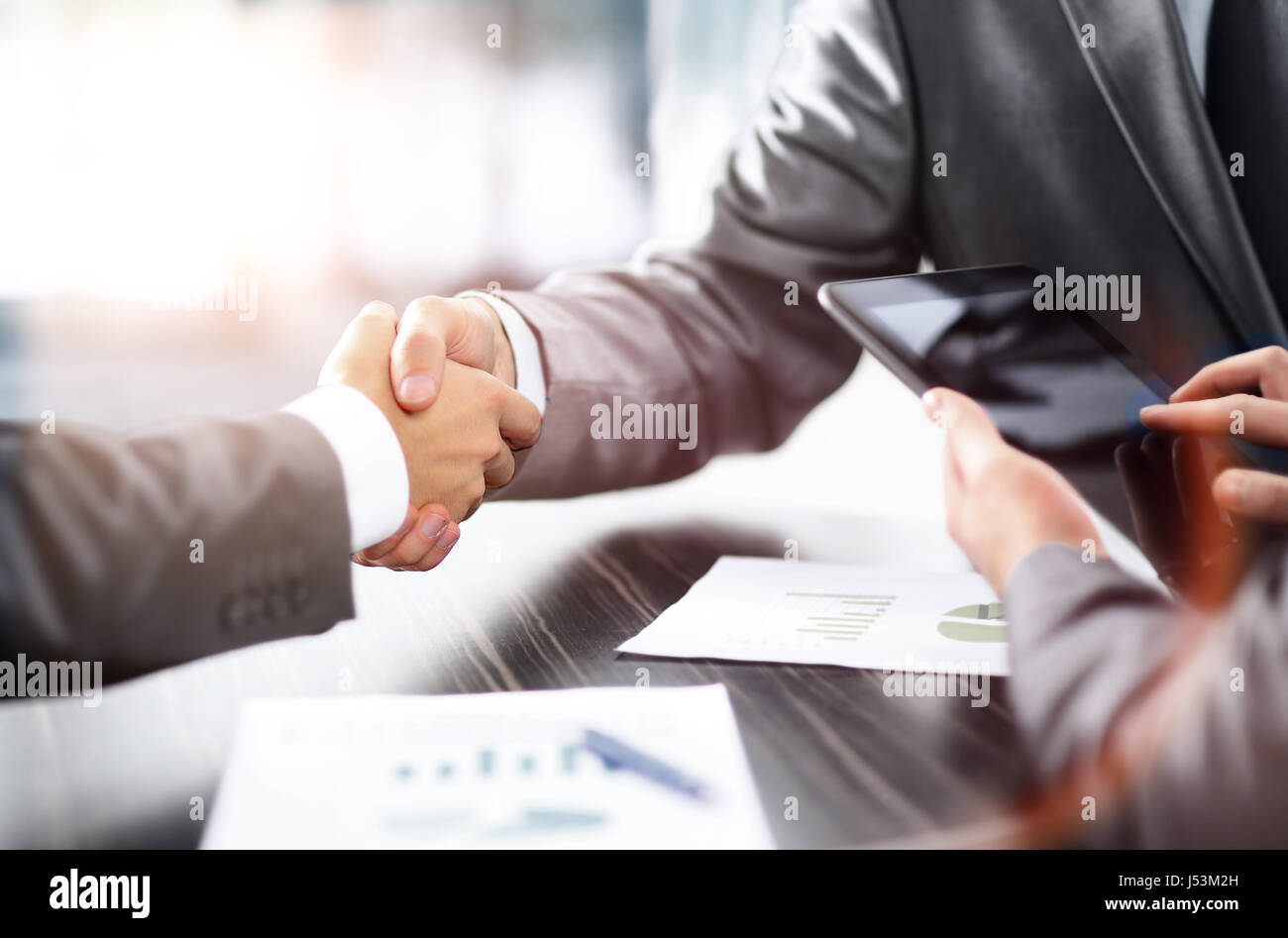 Business partners shaking hands Stock Photo - Alamy
